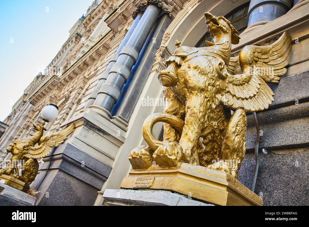 Golden Griffin Statues on Grand Building Facade, Low Angle View Stock ...