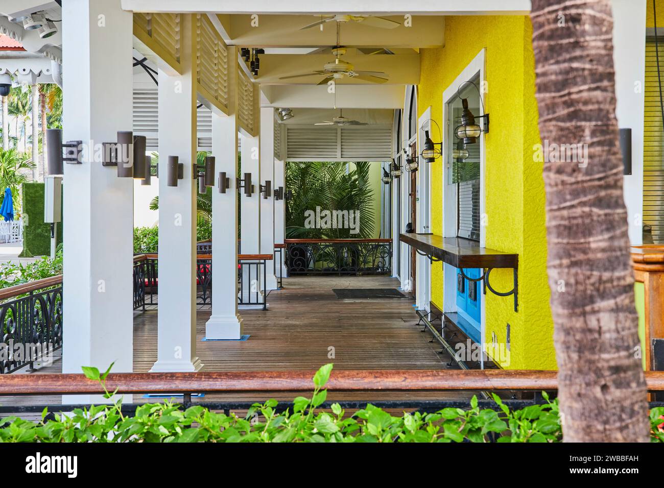 Tropical Resort Corridor with Lush Greenery and Ceiling Fans Stock ...