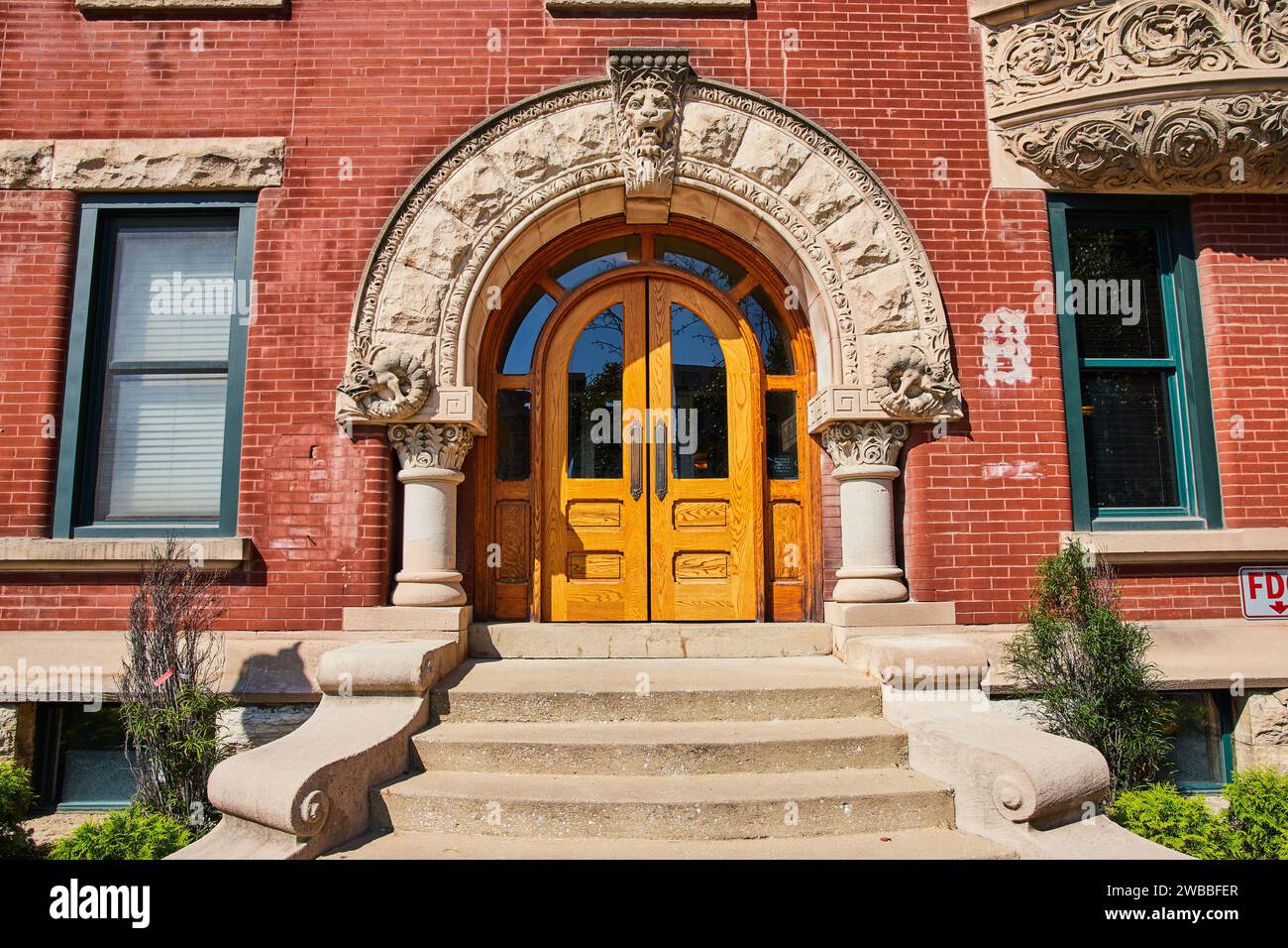 Victorian Wooden Double Door with Stone Archway and Columns Stock Photo ...