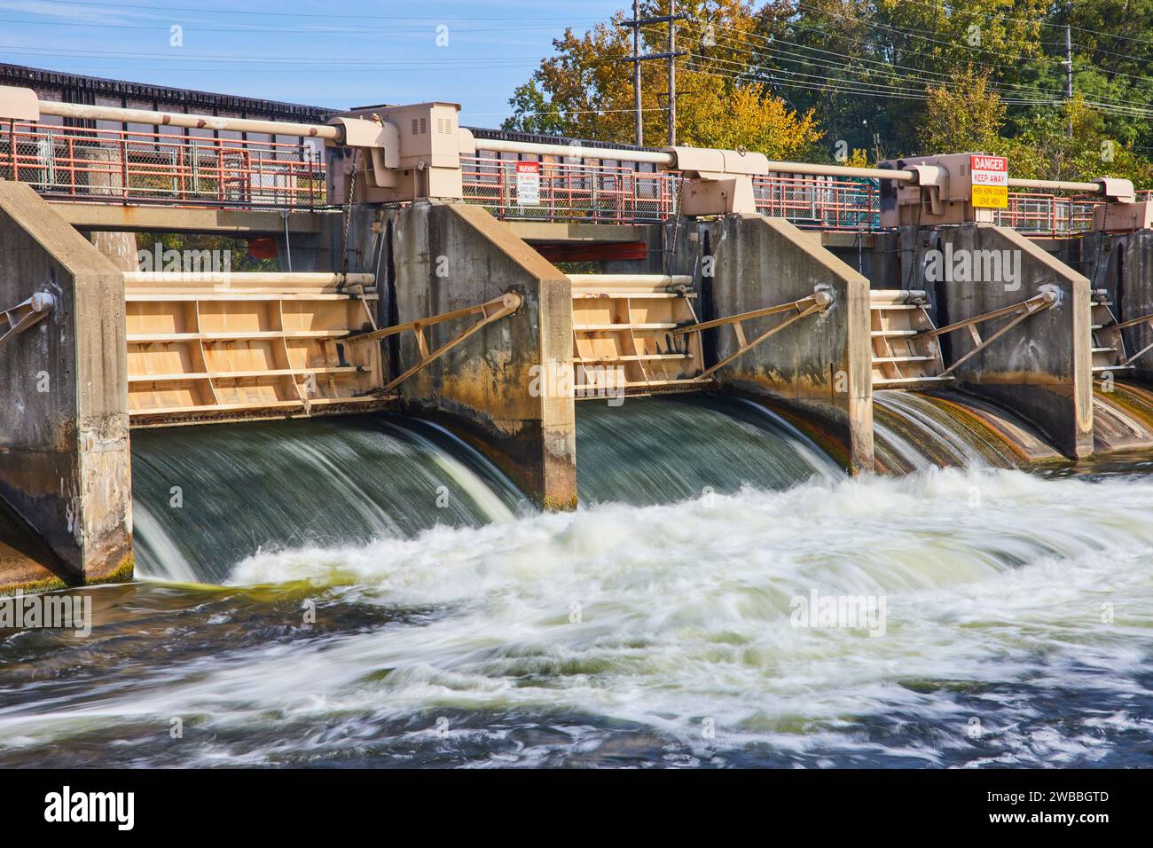 Dynamic Water Flow at Argo Dam with Safety Sign, Huron River, Eye-Level ...