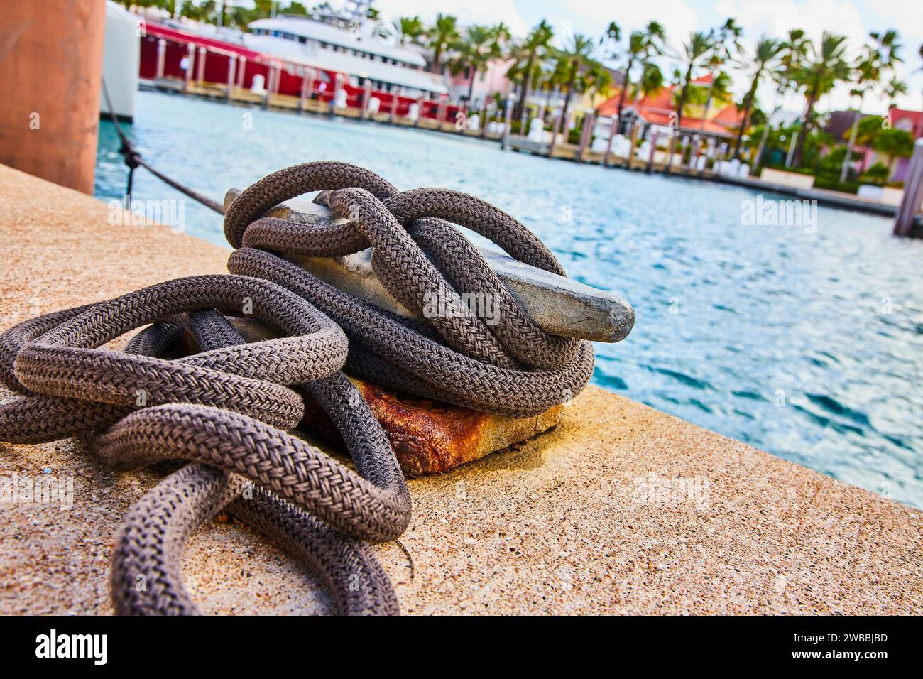 Secure Mooring Rope and Bollard on Tropical Dock Stock Photo - Alamy