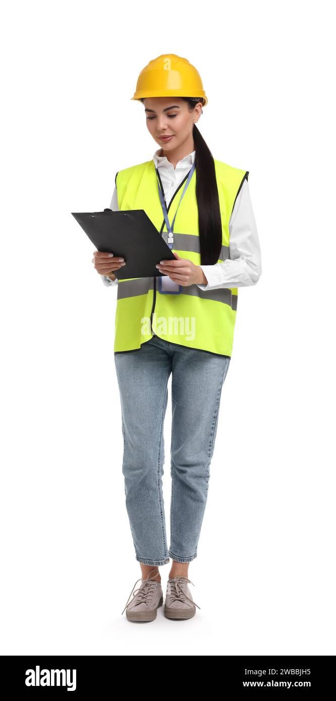 Engineer in hard hat holding clipboard on white background Stock Photo ...