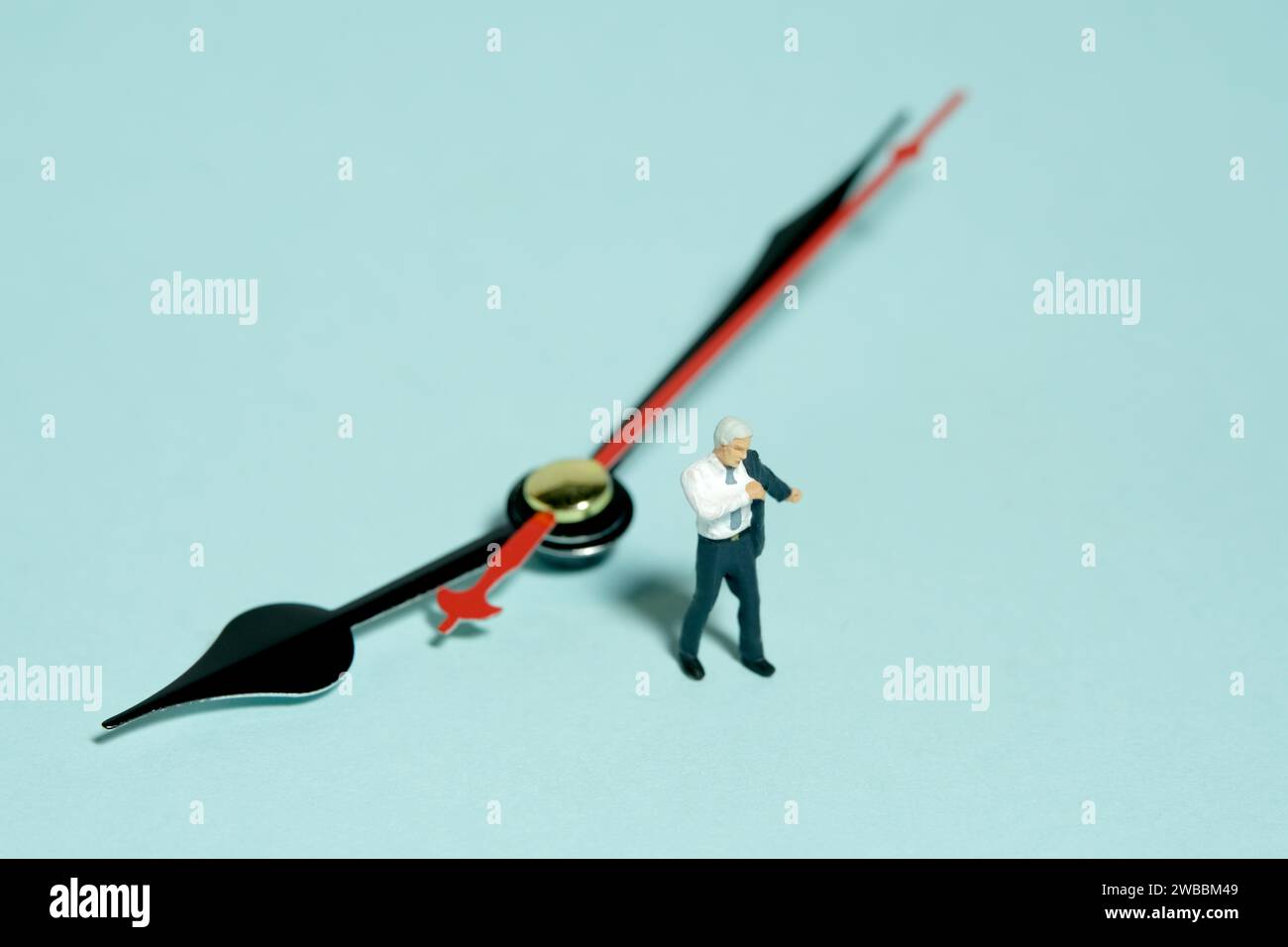 Miniature tiny people toy figure photography. A businessman getting ...