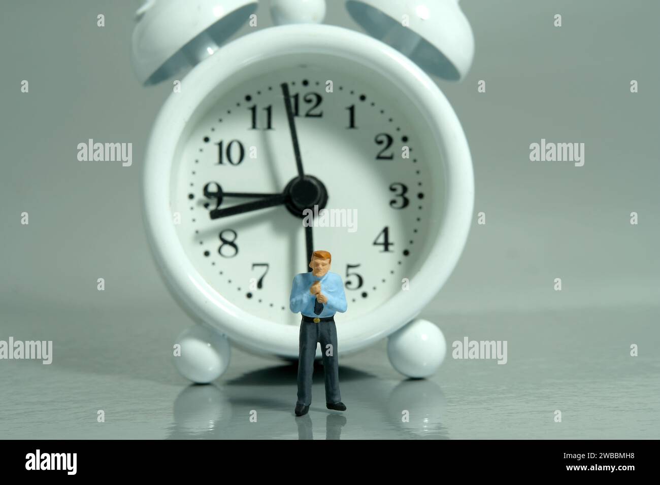 Miniature tiny people toy figure photography. A businessman getting ...