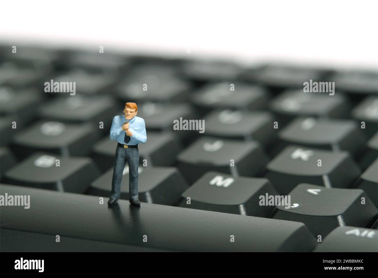 Miniature tiny people toy figure photography. A businessman getting ...