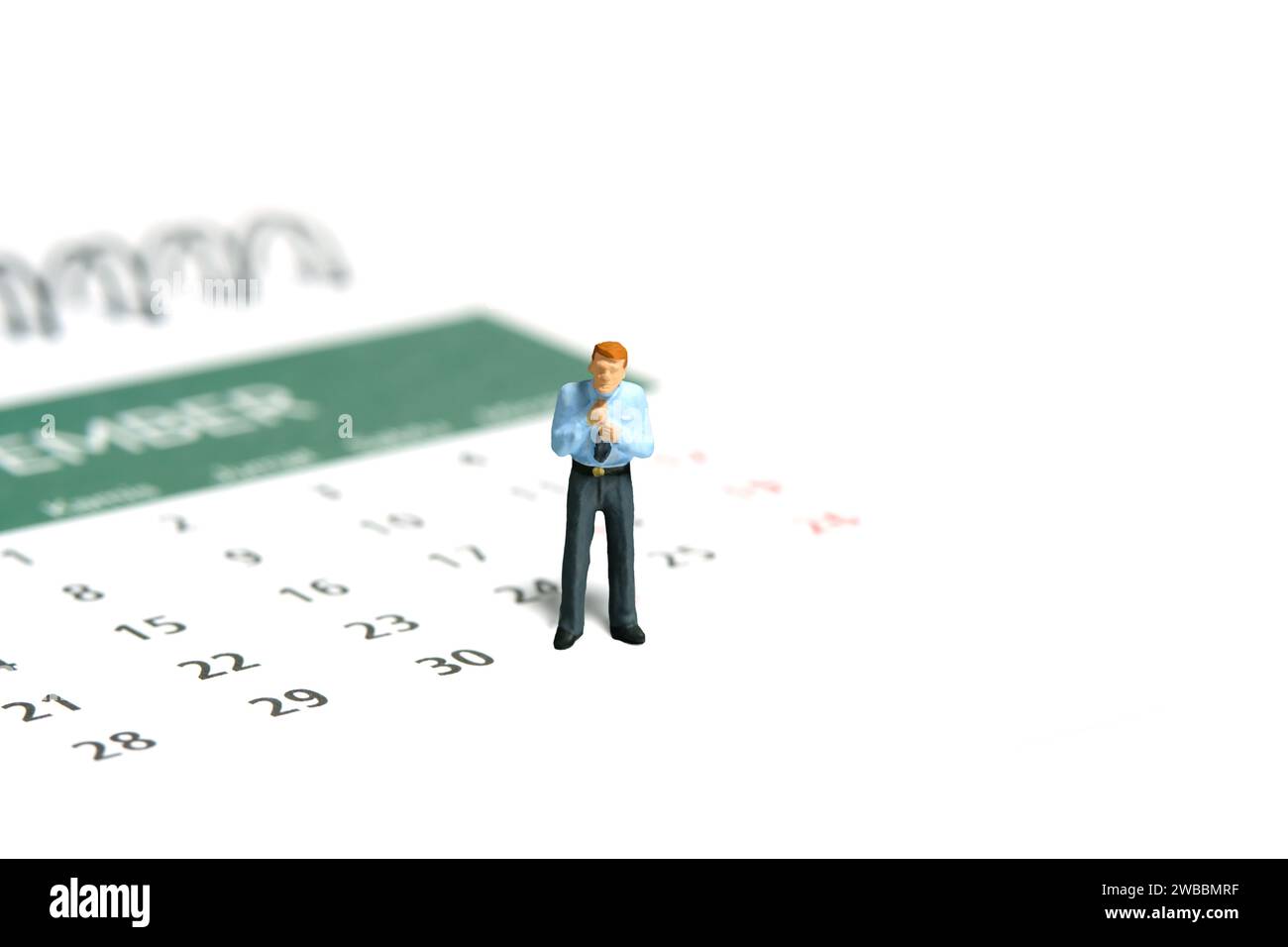 Miniature tiny people toy figure photography. A businessman getting ...