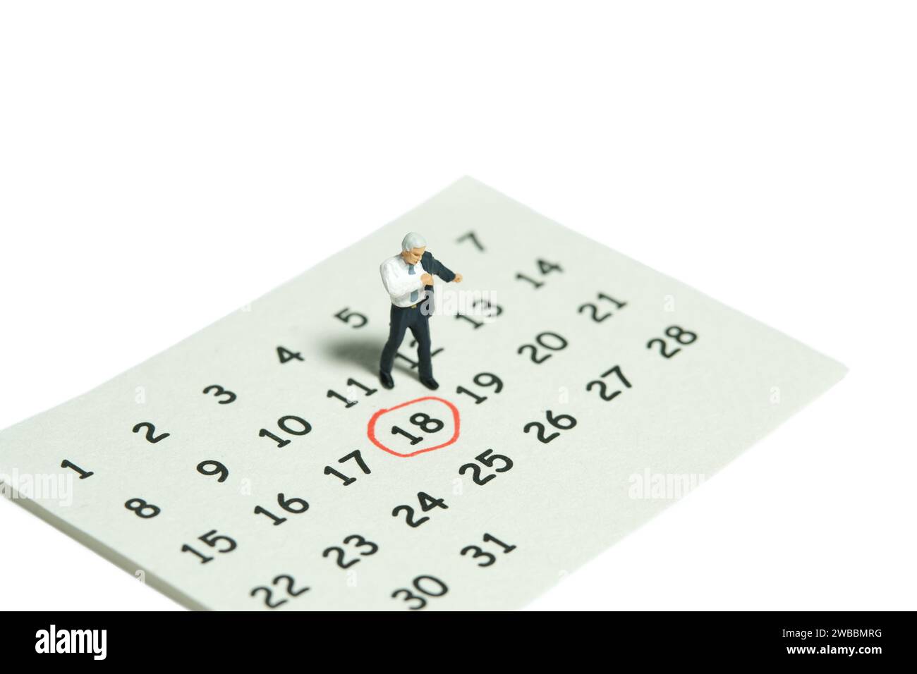 Miniature tiny people toy figure photography. A businessman getting ...