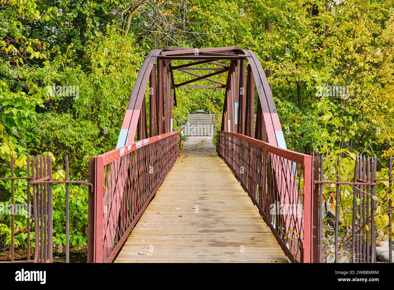 Rustic Metal Truss Bridge in Lush Park with Autumn Foliage, Eye-Level ...