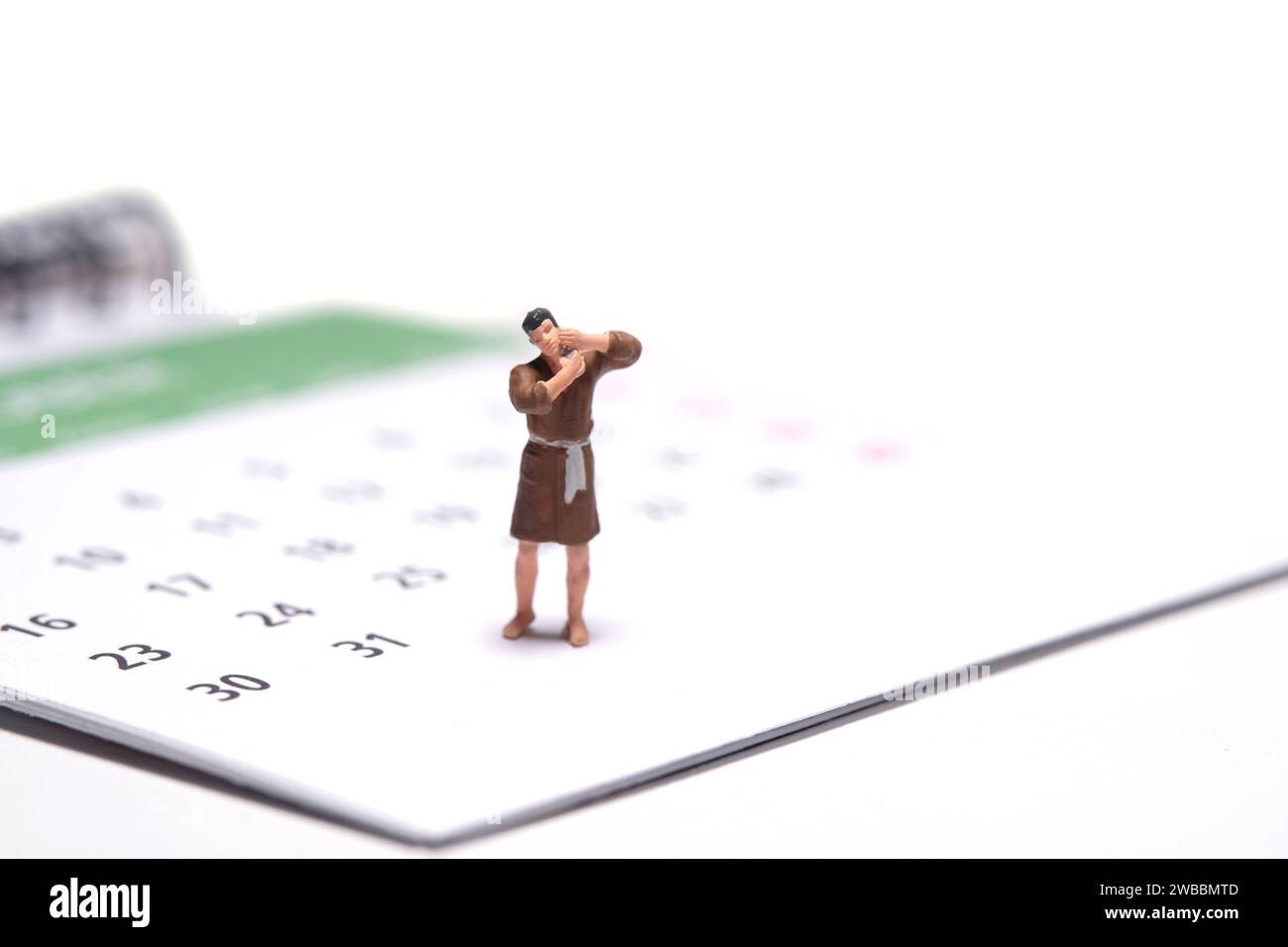 Miniature tiny people toy figure photography. A man wearing bathrobe ...