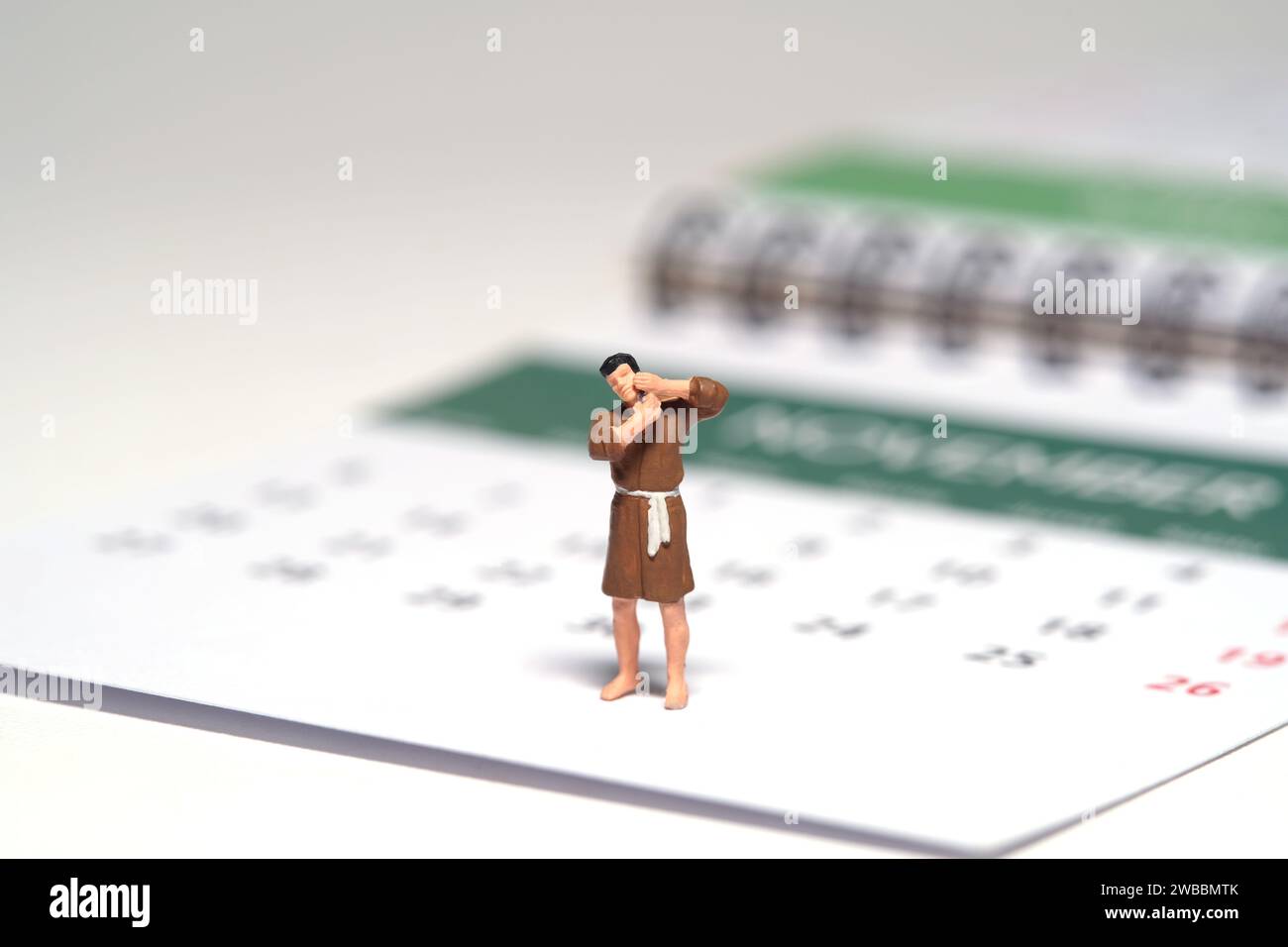 Miniature tiny people toy figure photography. A man wearing bathrobe ...