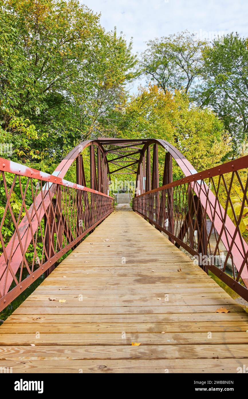 Rustic Red Pedestrian Bridge in Autumn Park - Eye-Level View Stock ...
