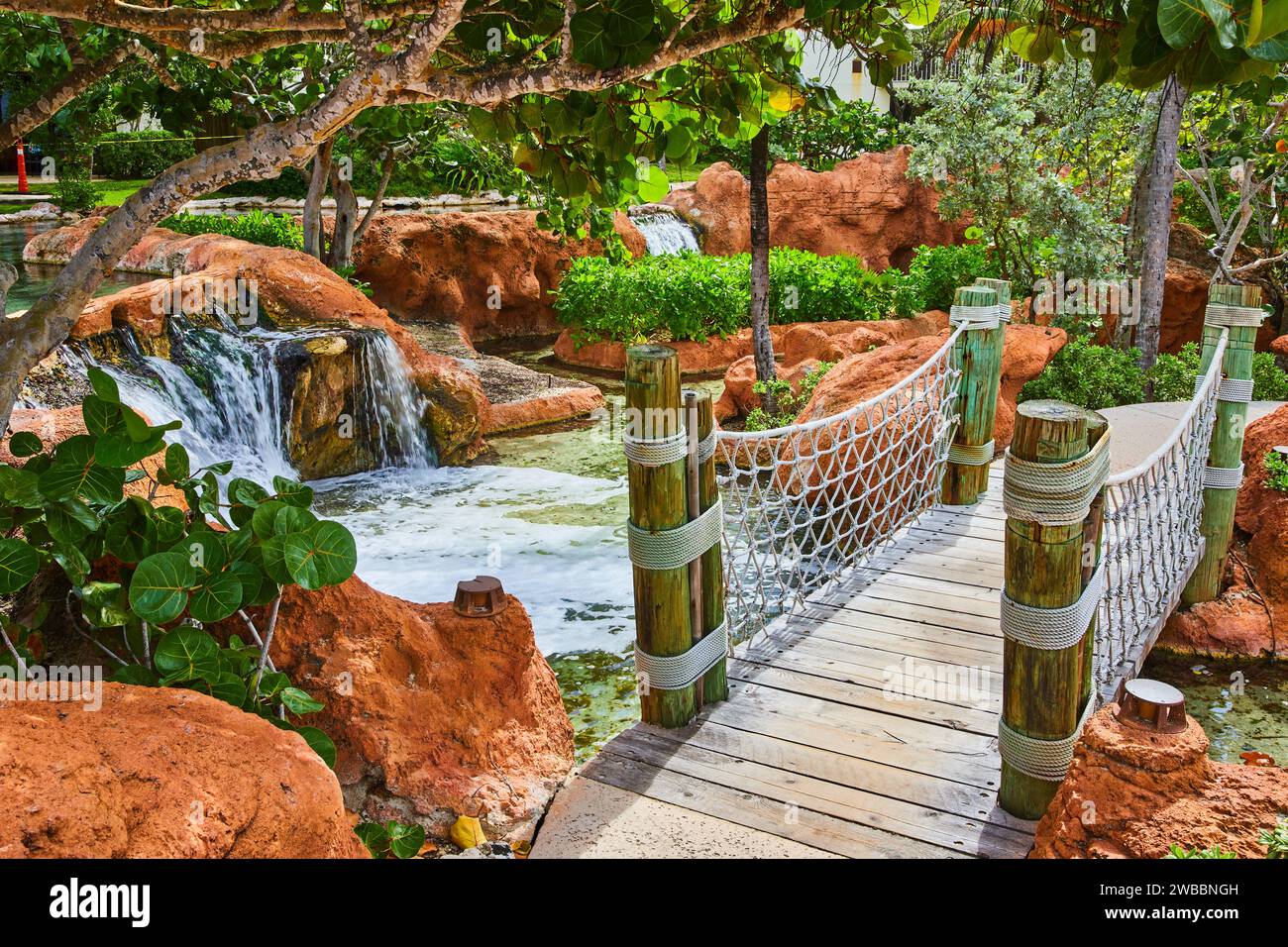 Plank Wood Bridge Under A Waterfall Small Bridge Over A Stream Next To