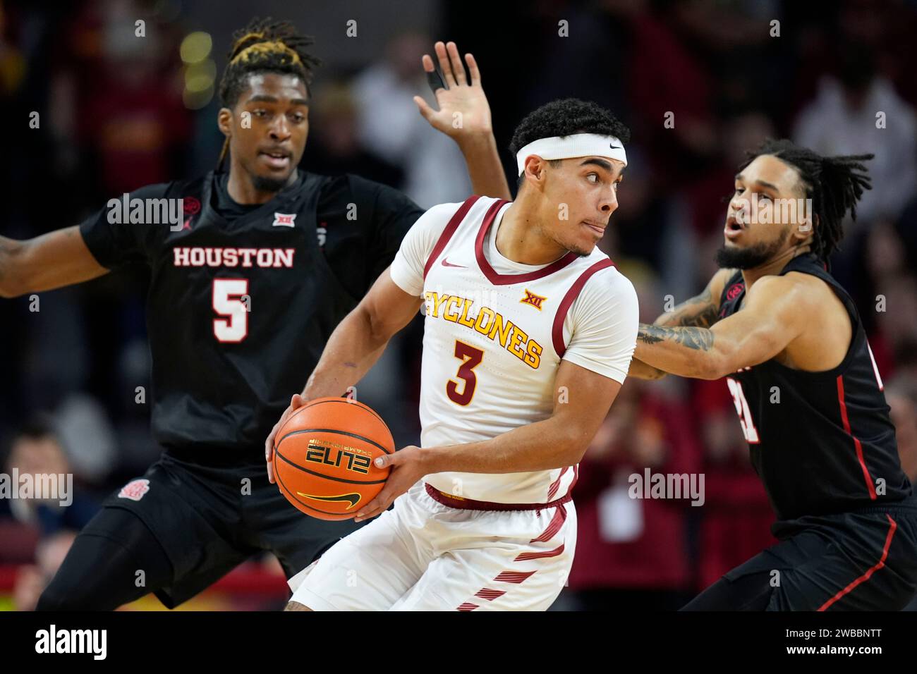 Iowa State guard Tamin Lipsey (3) drives between Houston forward Ja ...