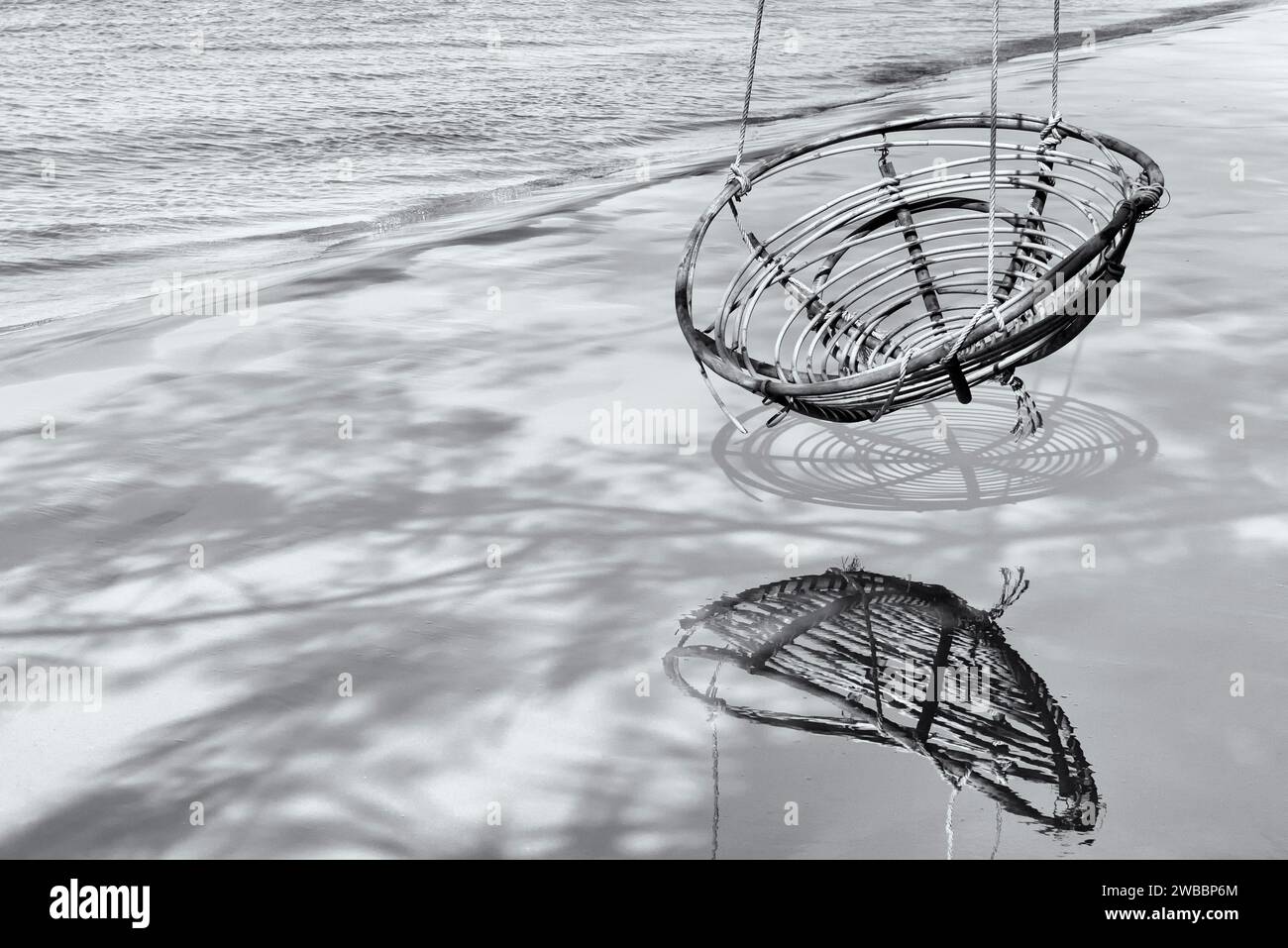 Rustic swing chair on the beach Stock Photo - Alamy