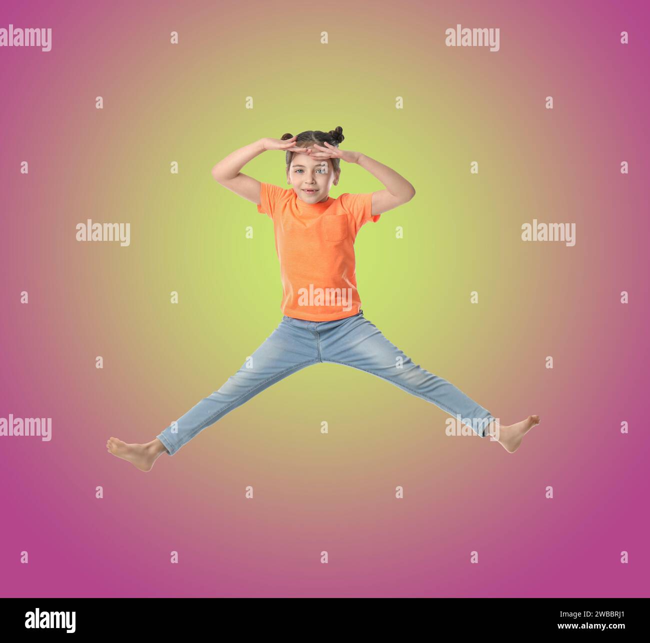 Happy cute girl jumping on color gradient background Stock Photo - Alamy