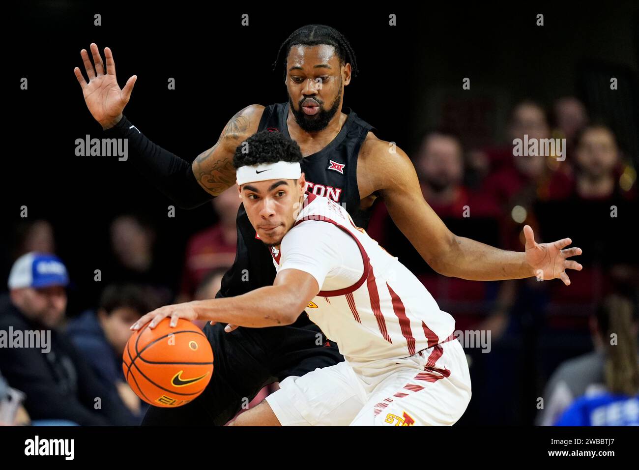 Iowa State guard Tamin Lipsey drives around Houston forward J'Wan ...