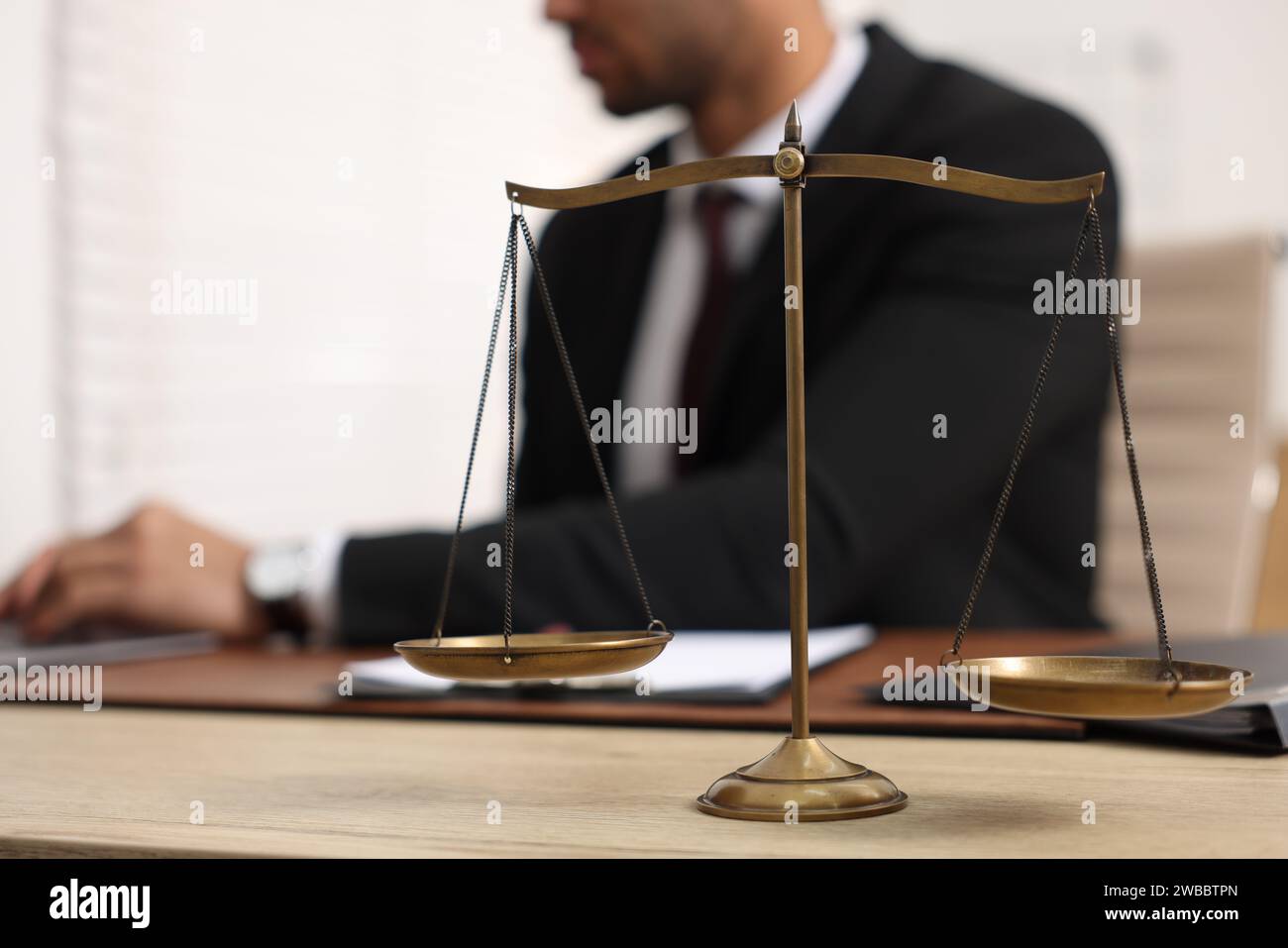 Lawyer working at table in office, focus on scales of justice Stock ...