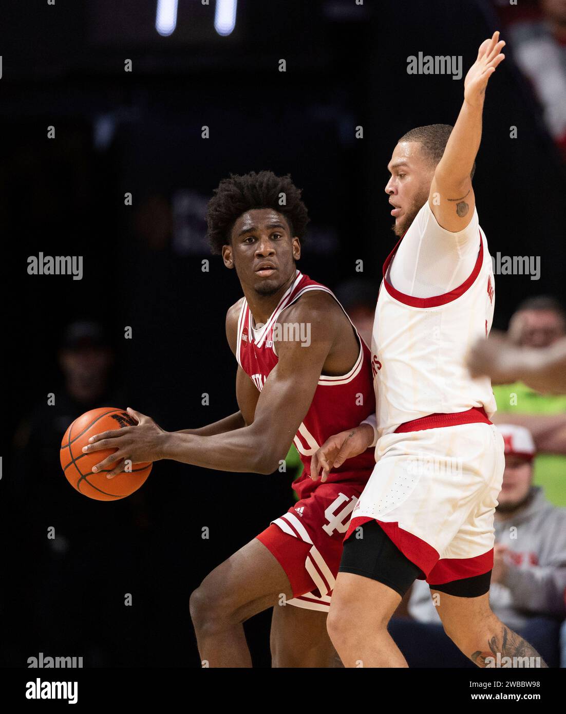 Nebraska's C.J. Wilcher, right, guards against Indiana's Kaleb Banks ...