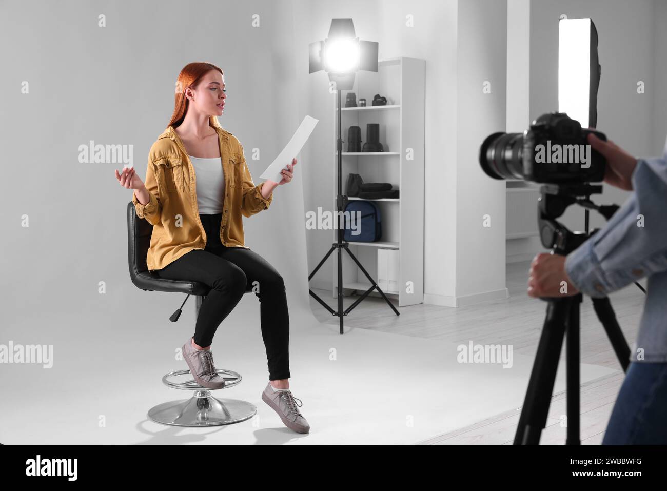 Casting call. Woman with script performing while camera operator ...