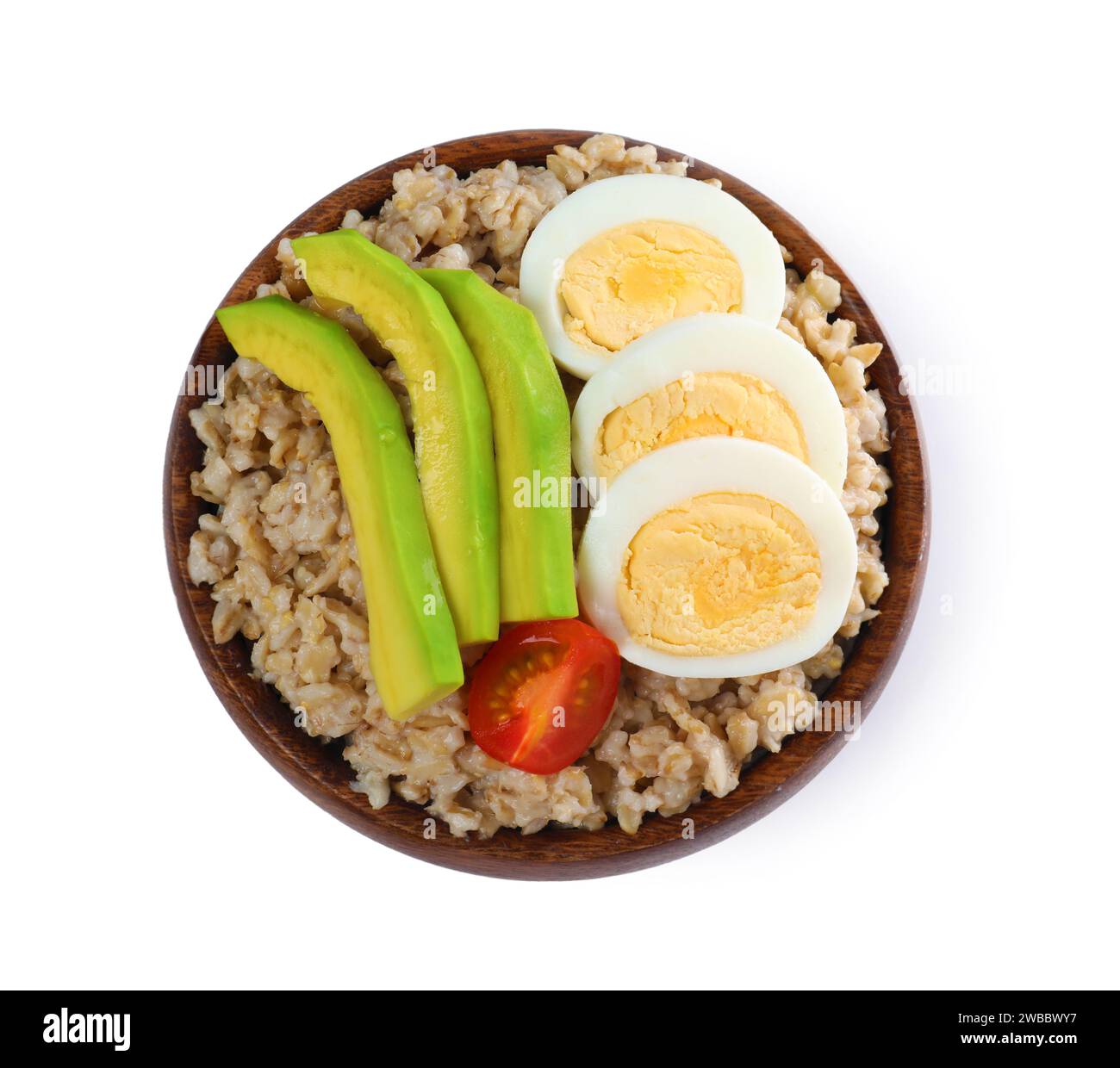 Tasty boiled oatmeal with egg, avocado and tomato isolated on white ...