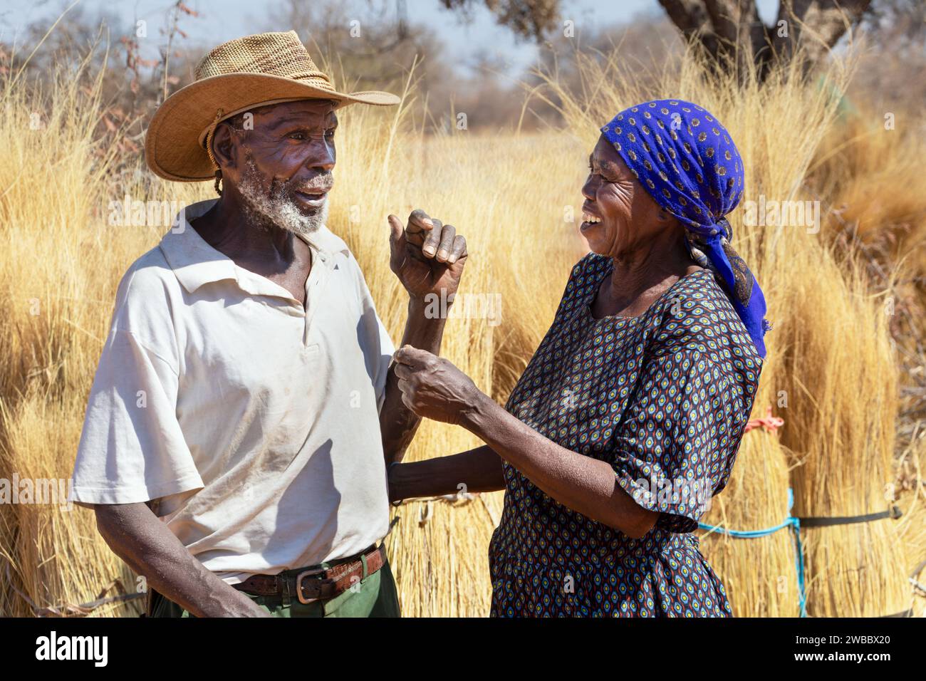 portrait of an village african old couple happily chatting away in the ...