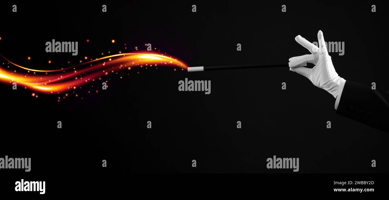 Magician showing trick with wand black background, closeup. Banner ...