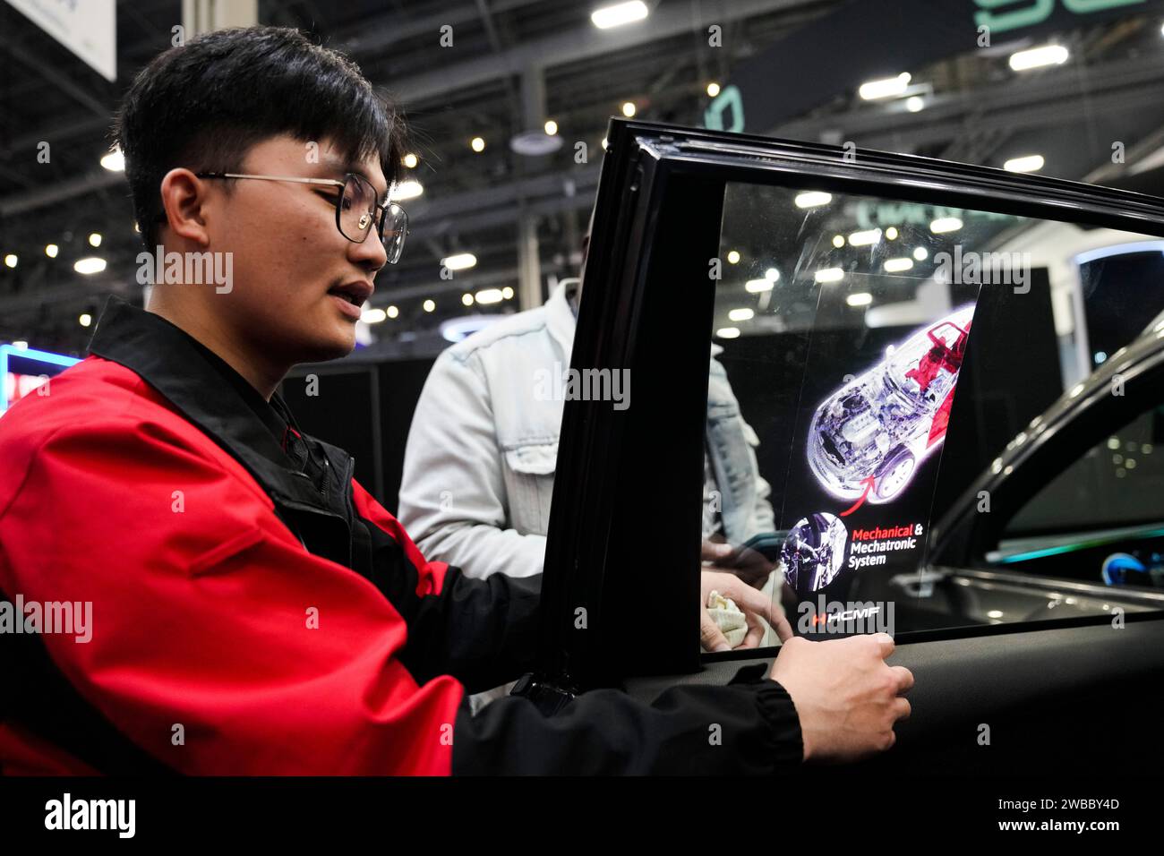 Leon Zhang, HCMF Group, demonstrates an LED window designed in ...