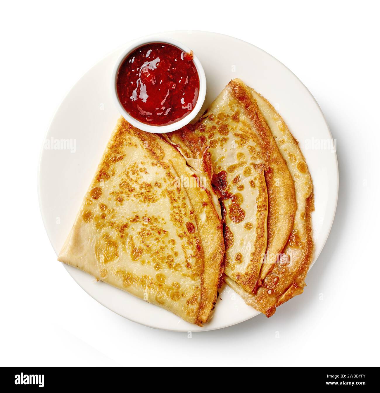 plate of crepes and strawberry jam isolated on white background, top ...