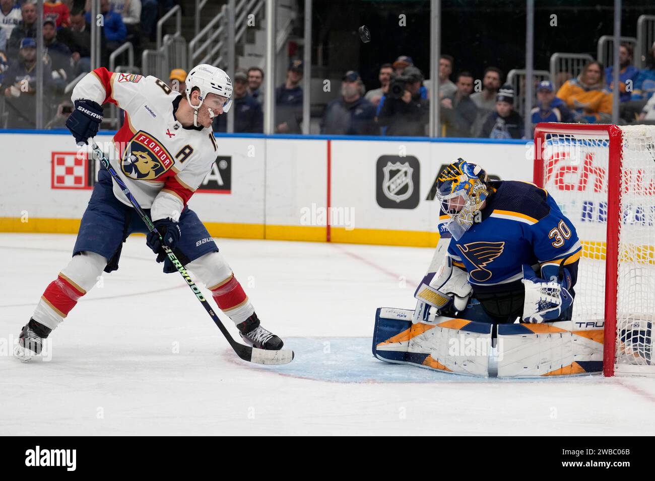A shot by Florida Panthers' Matthew Tkachuk, left, bounces off St. Louis Blues goaltender Joel ...