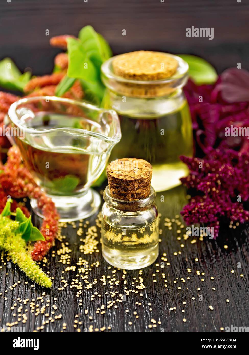 Amaranth oil in a glass bottle, gravy boat and jar, brown, green and ...