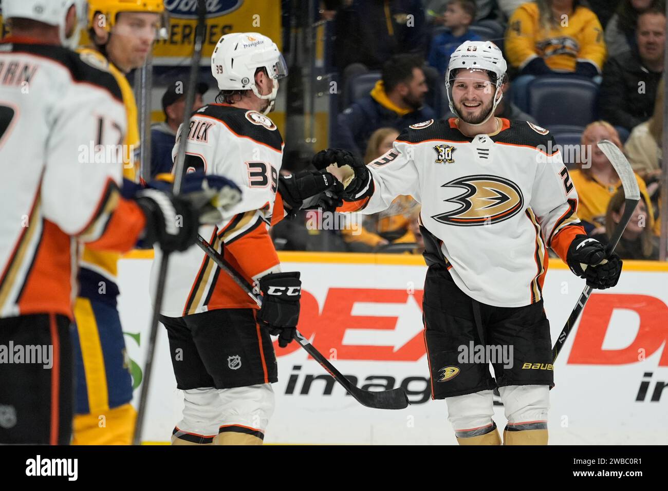 Anaheim Ducks center Mason McTavish, right, celebrates a goal with ...
