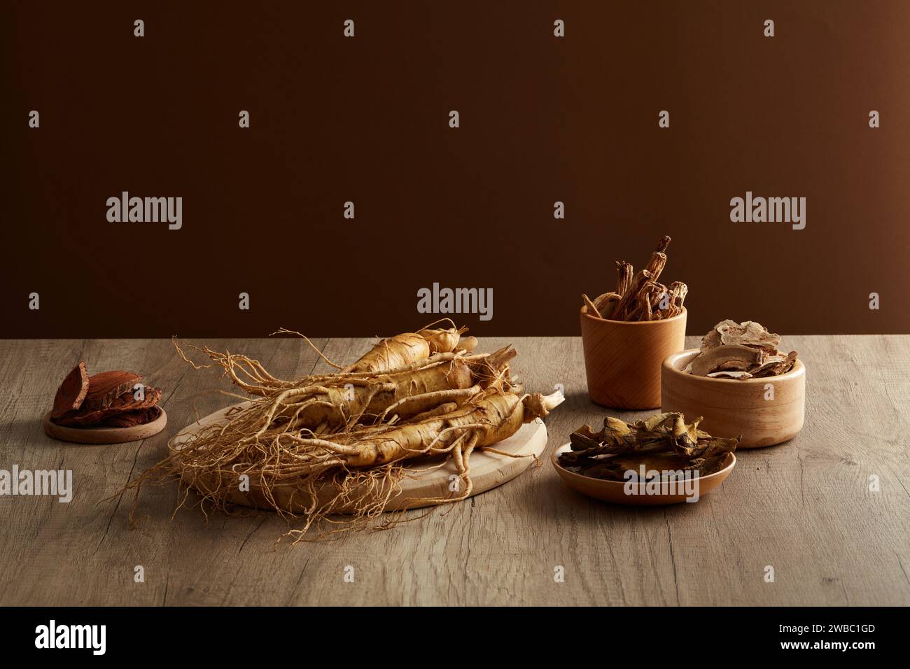 On the wooden table and brown background, chinese traditional medicine ...