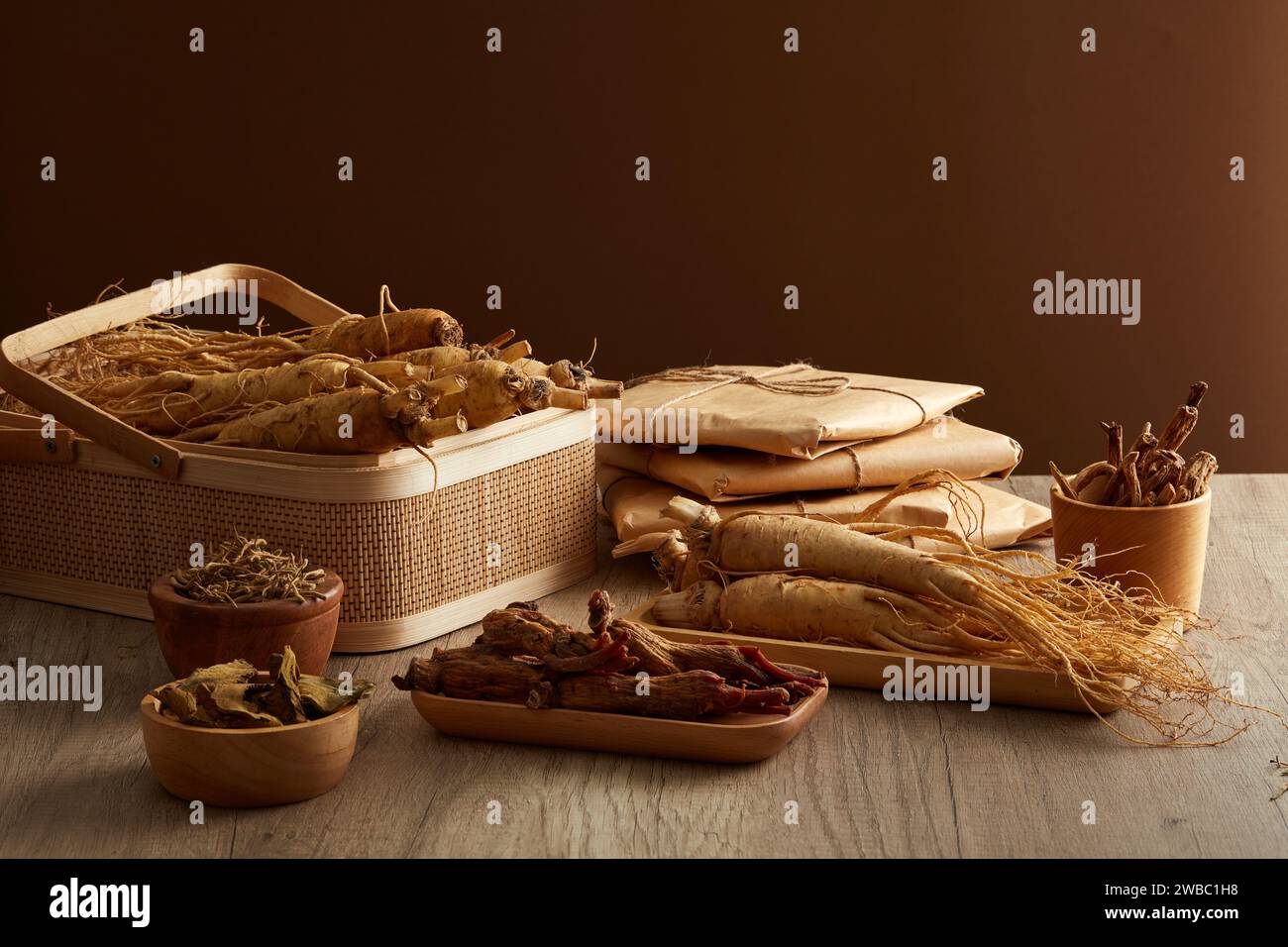 On the wooden table and brown background, traditional Chinese medicines ...