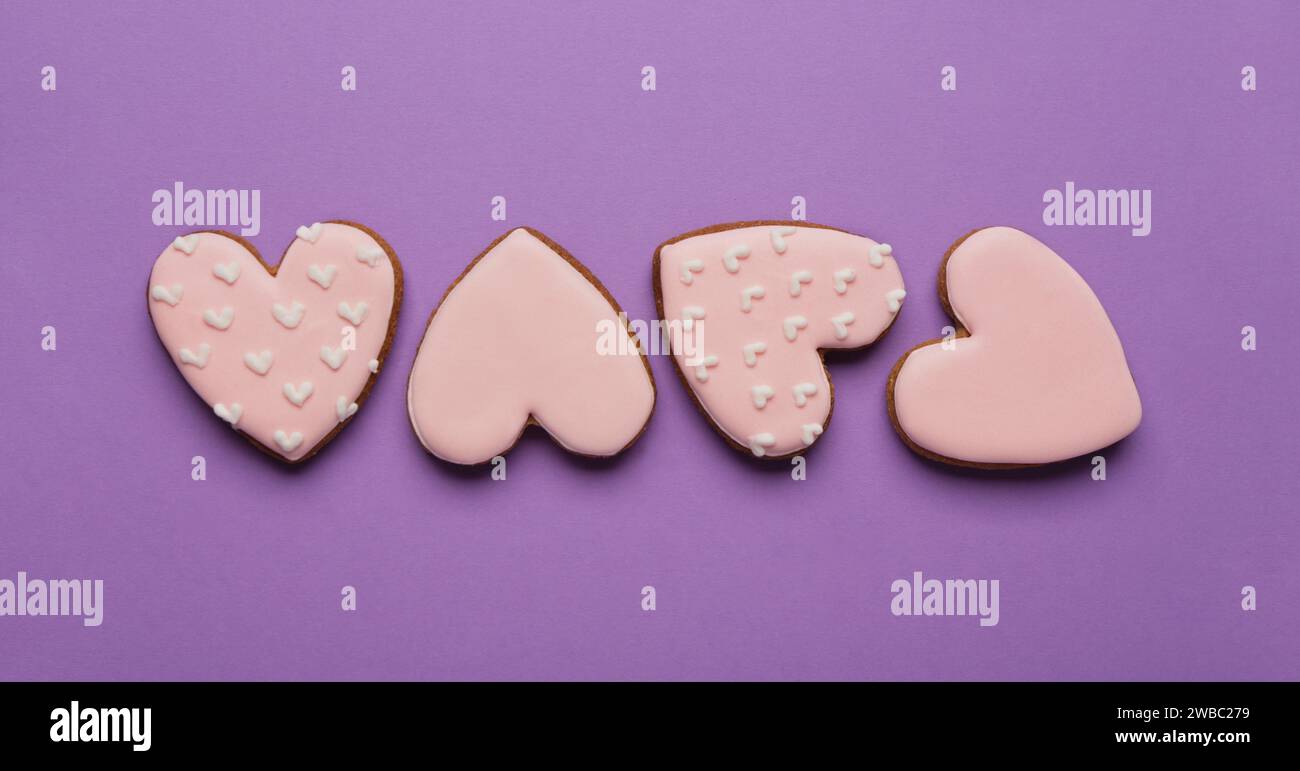 Heart shaped sweet cookies on purple background. Valentine's day ...