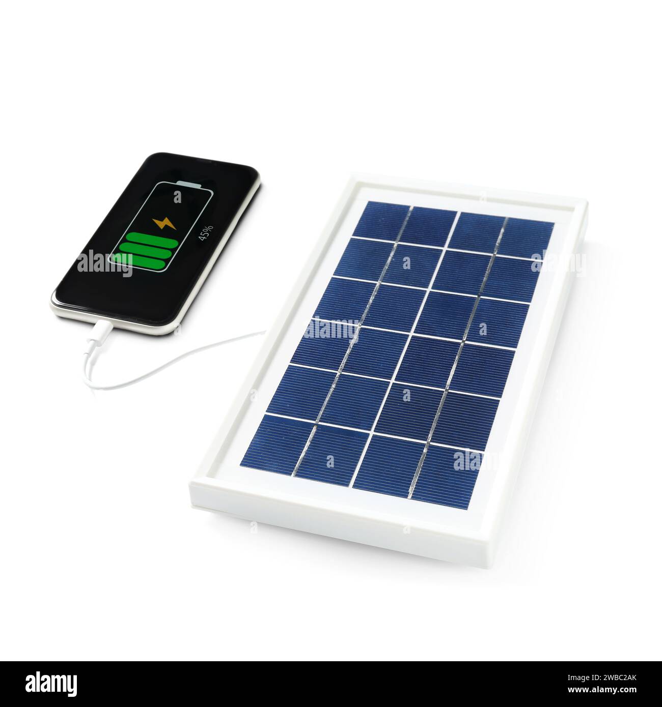 Portable solar panel charging mobile phone on white background Stock ...