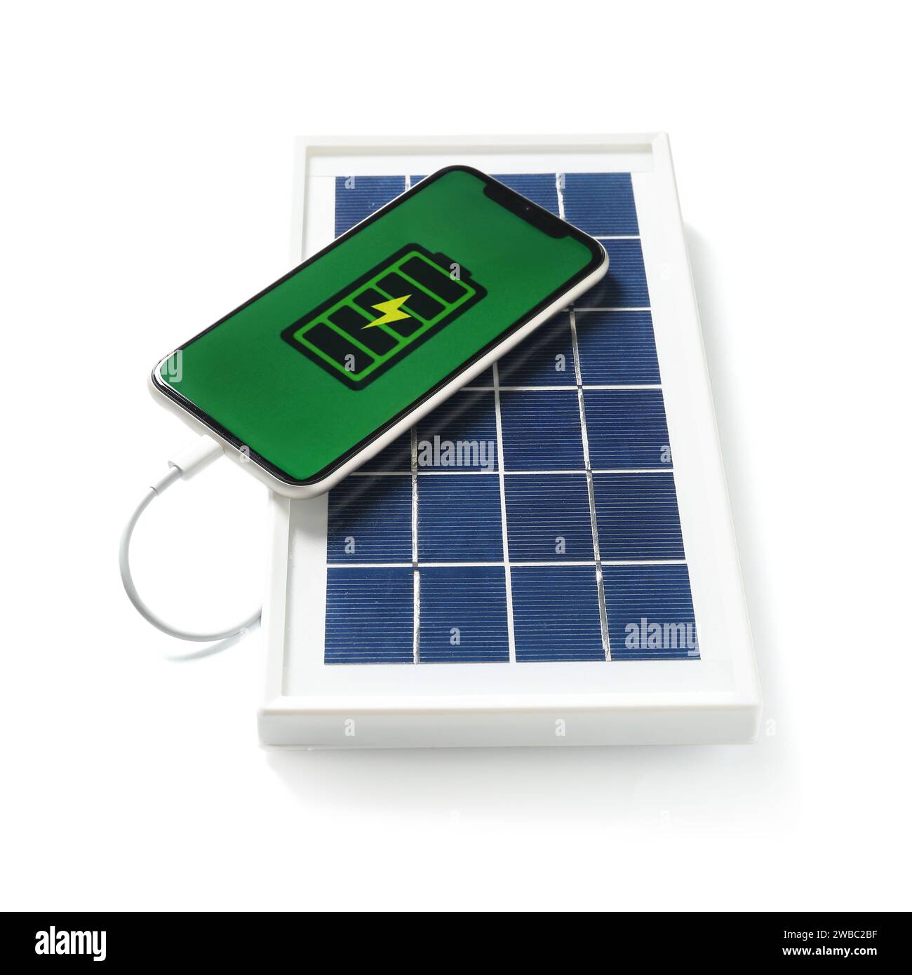 Portable solar panel with charged mobile phone on white background ...