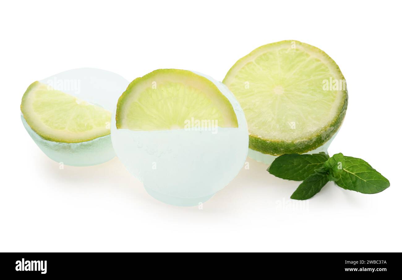 Slices of fresh lime frozen in ice on white background Stock Photo - Alamy