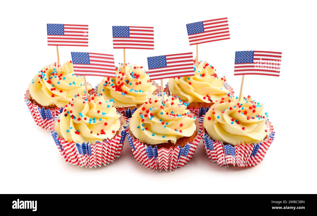 Tasty patriotic cupcakes and flag of USA on white background. American ...