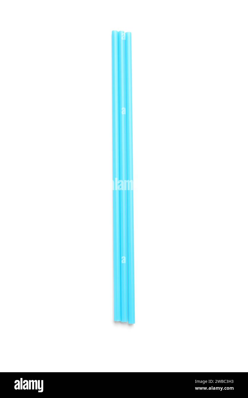 Blue plastic straws on white background Stock Photo - Alamy