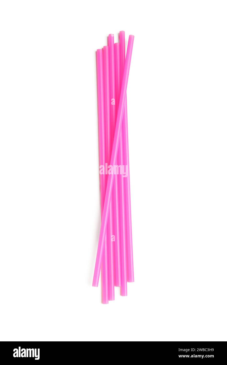 Pink plastic straws on white background Stock Photo - Alamy