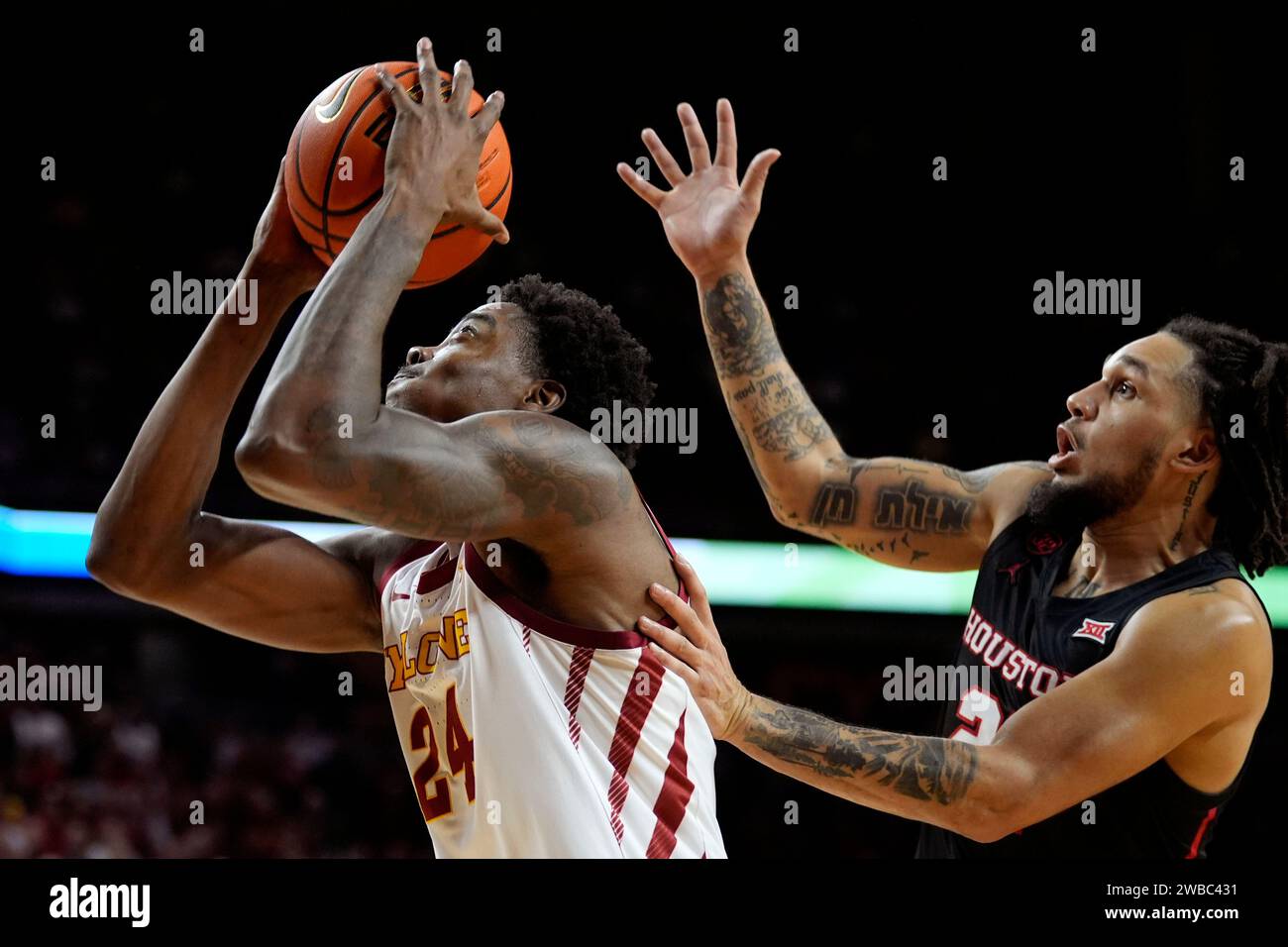 Iowa State forward Hason Ward (24) drives to the basket past Houston ...