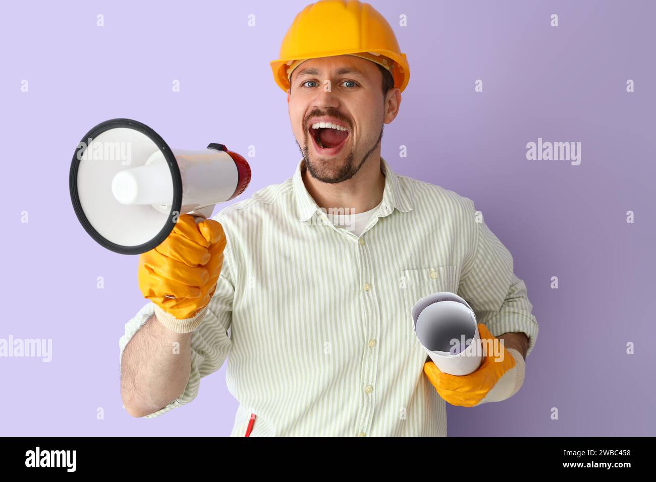 Male builder with house plan shouting into megaphone on lilac ...