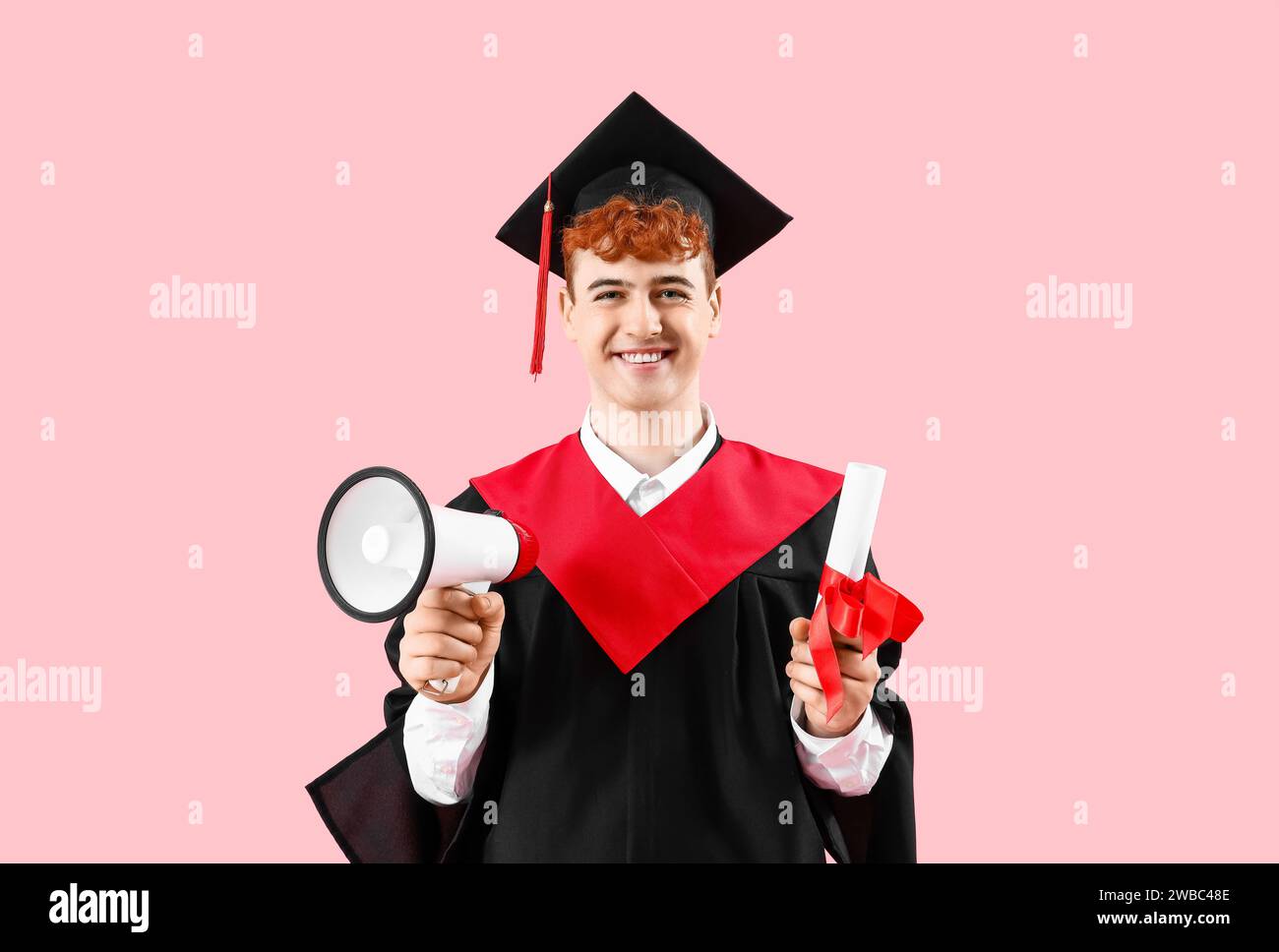 Male graduate student with diploma and megaphone on pink background ...