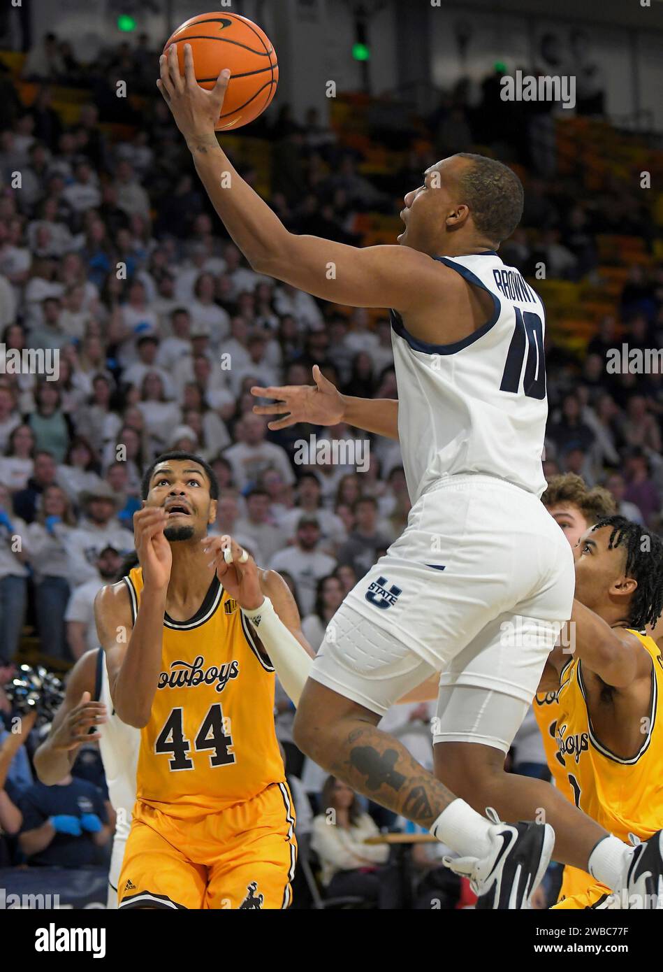 Utah State guard Darius Brown II (10) drives to the basket as Wyoming ...