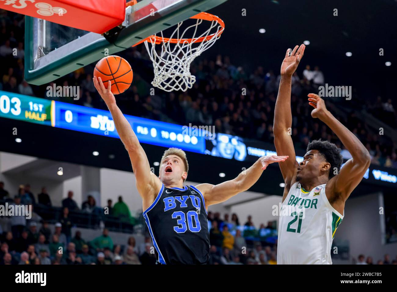 BYU guard Dallin Hall (30) scores against Baylor center Yves Missi (21 ...