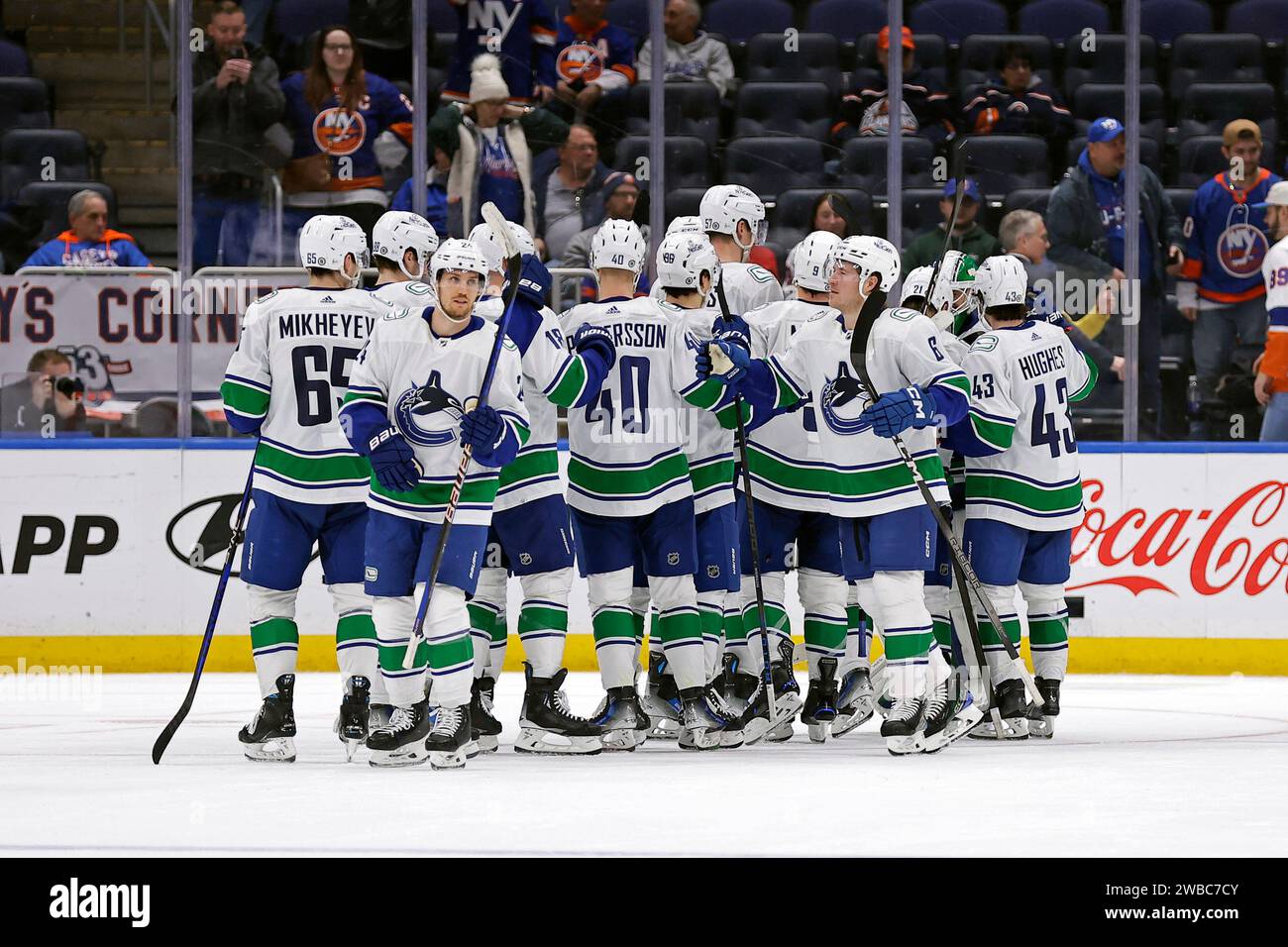 The Vancouver Canucks celebrate after defeating the New York Islanders ...