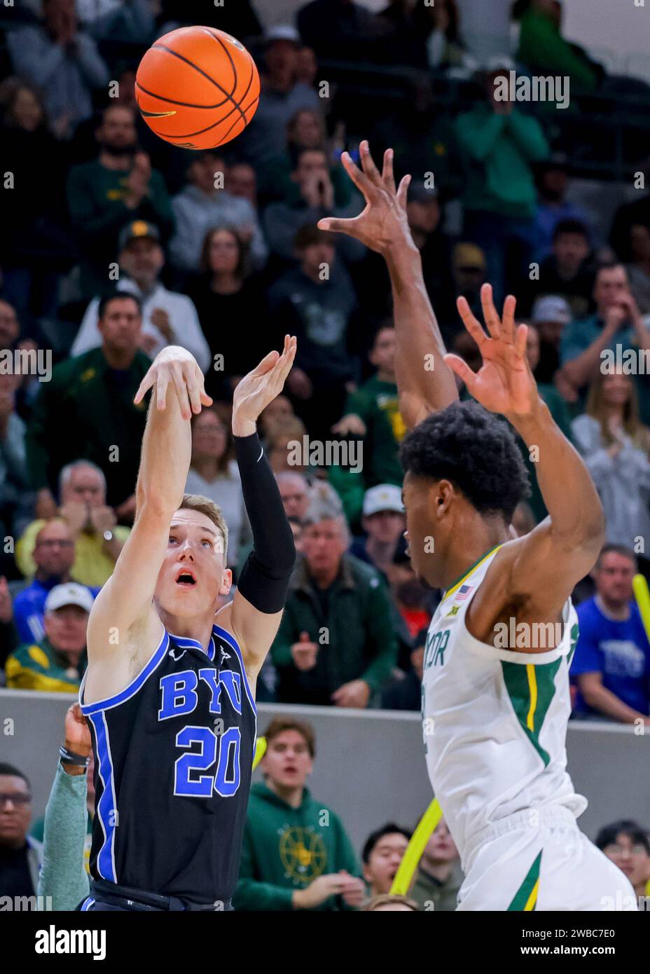 BYU guard Spencer Johnson (20) shoots over Baylor center Yves Missi (21 ...