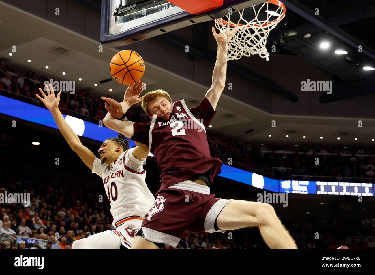 Texas A&M guard Hayden Hefner (2) is fouled by Auburn guard Chad Baker ...