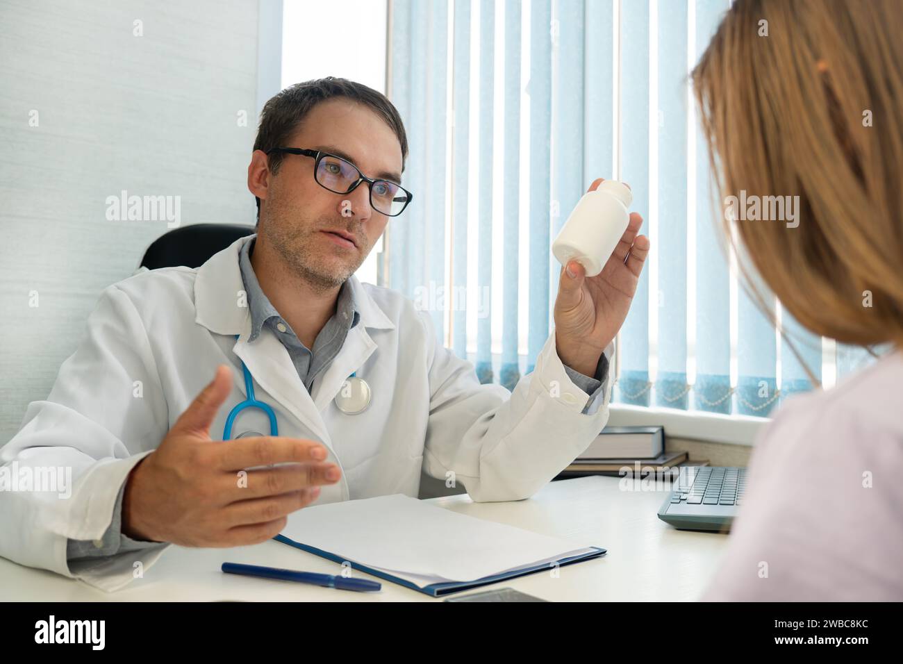 Woman doctor prescribing medication male hi-res stock photography and ...