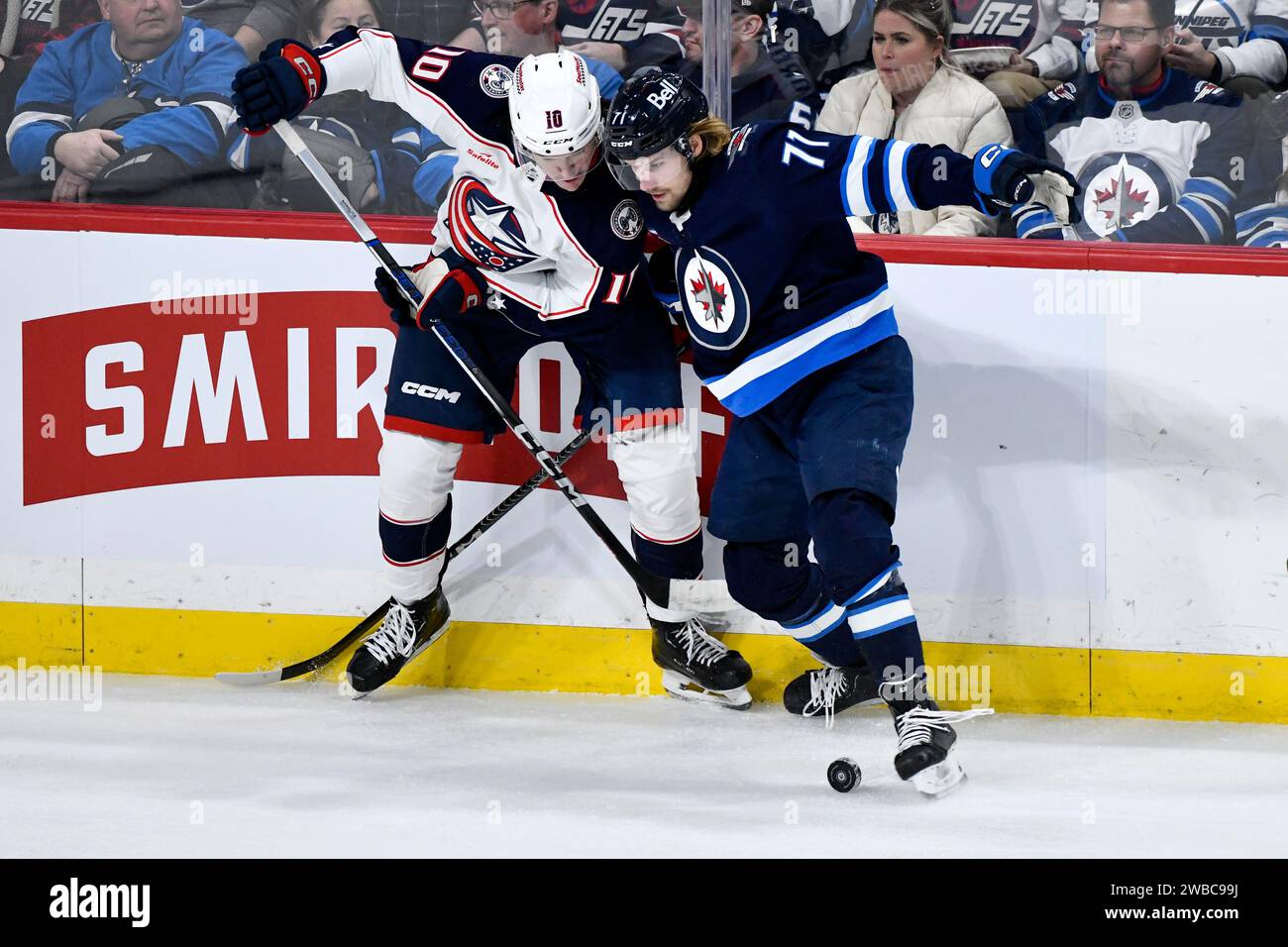 Columbus Blue Jackets' Dmitri Voronkov (10) and Winnipeg Jets' Axel ...